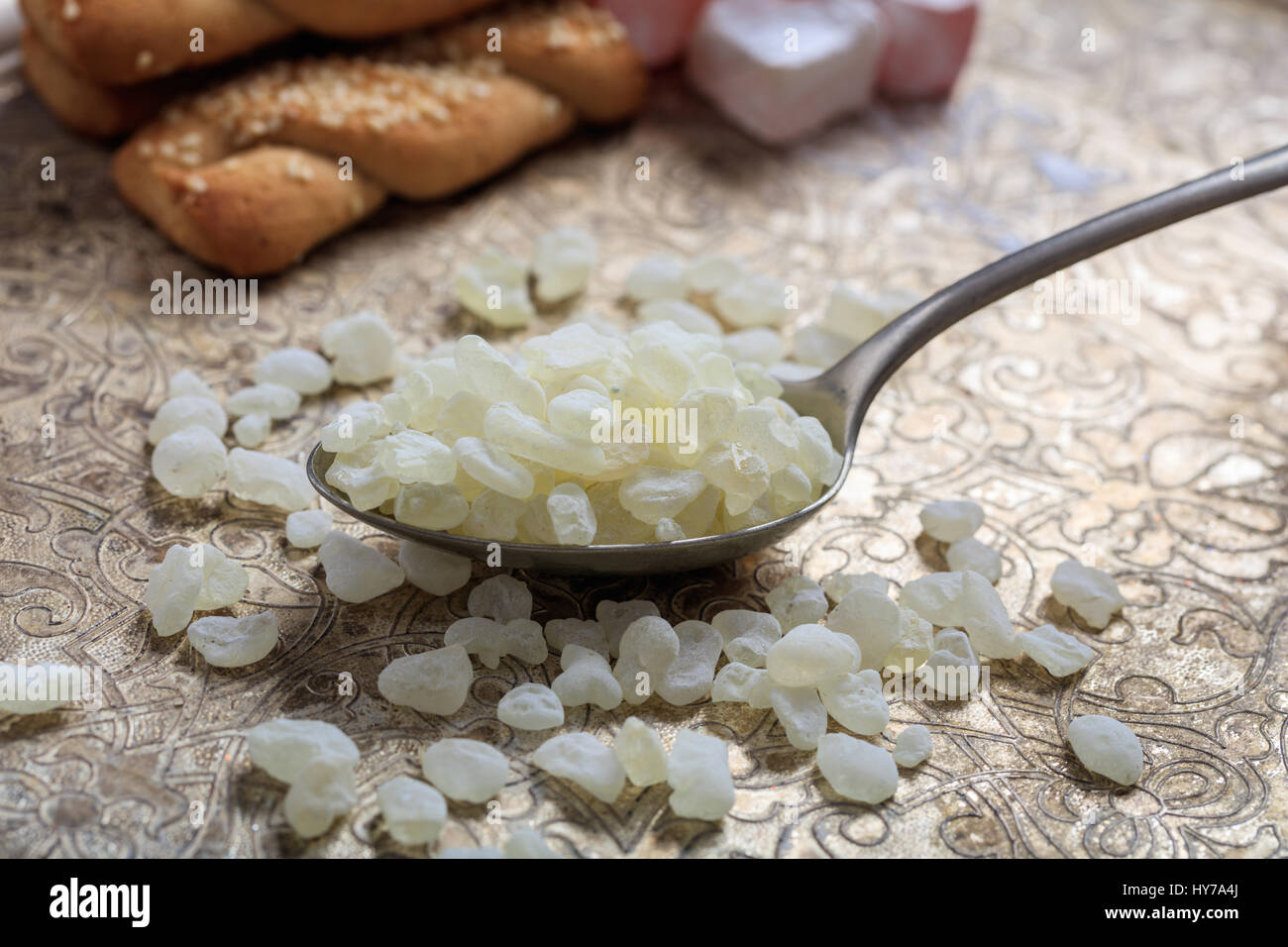 Chios mastic tears in a spoon on a silver background Stock Photo - Alamy