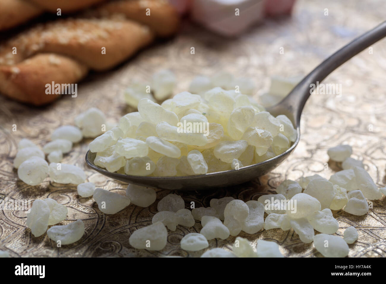 Chios mastic tears in a spoon on a silver background Stock Photo - Alamy