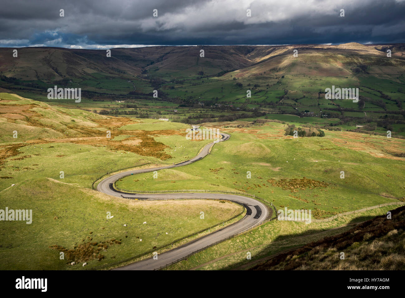 Bendy, winding road leading into the Vale of Edale in the peak District ...
