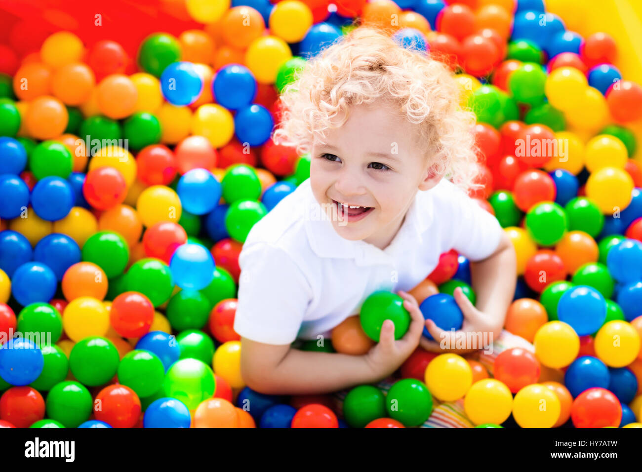 Child in ball pit hi-res stock photography and images - Alamy