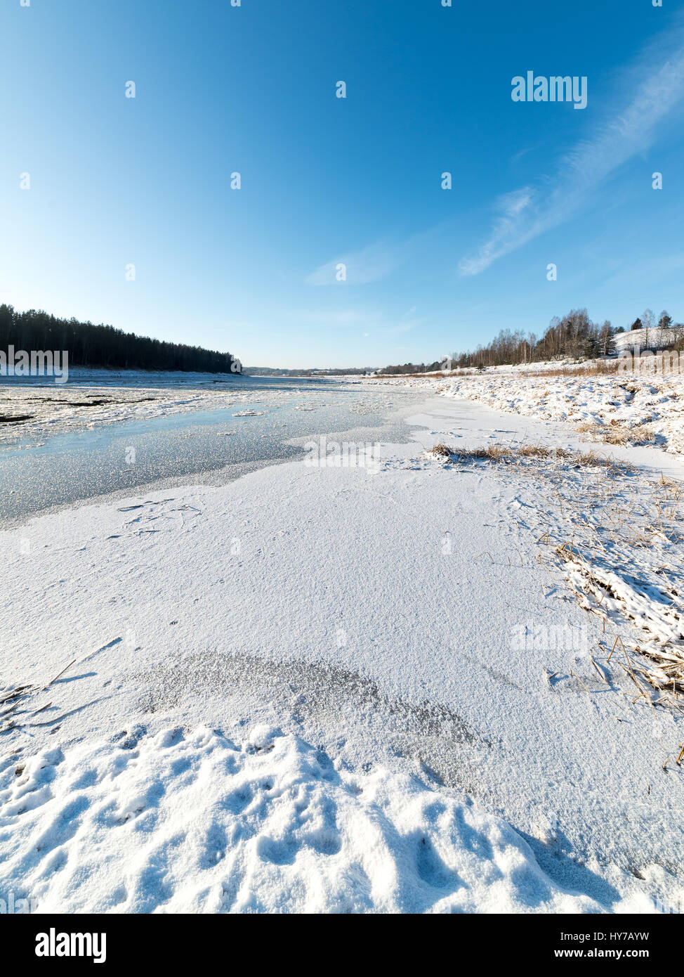 beautiful snowy winter landscape with frozen river and blue sky Stock ...