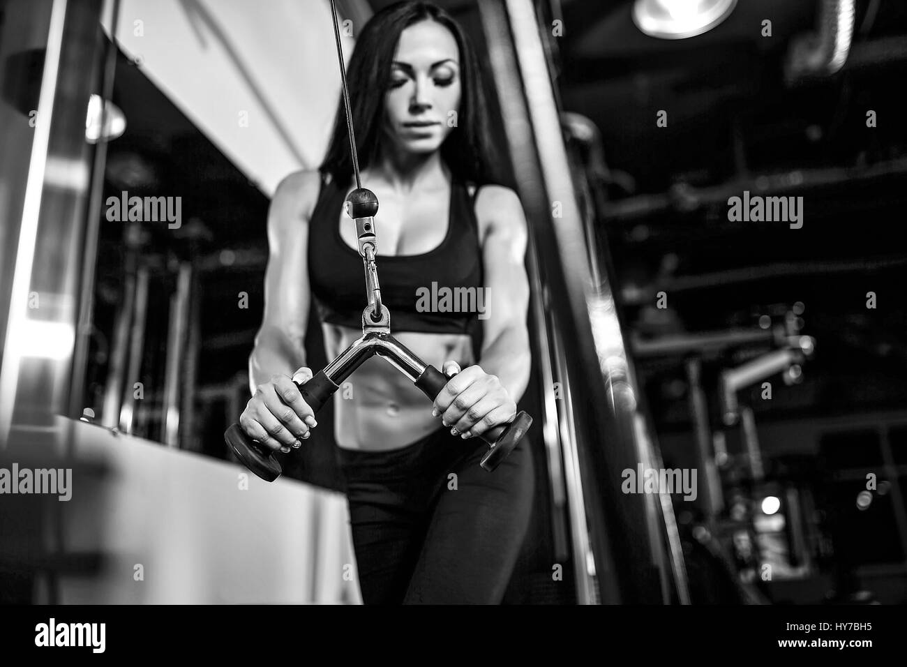 Female bodybuilder flexing biceps Black and White Stock Photos & Images ...