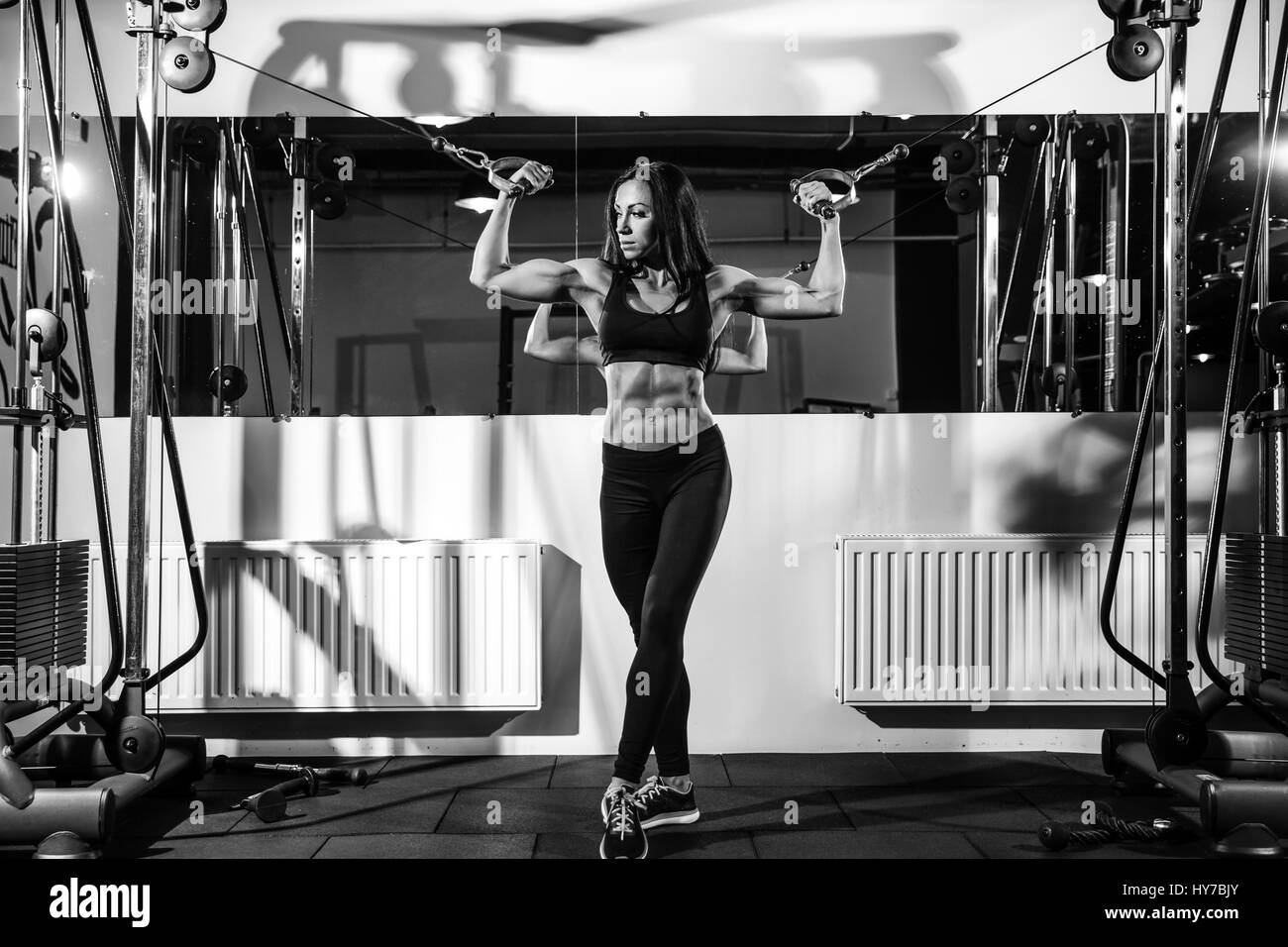 Female Bodybuilder Flexing Biceps Stock Photos & Female Bodybuilder ...