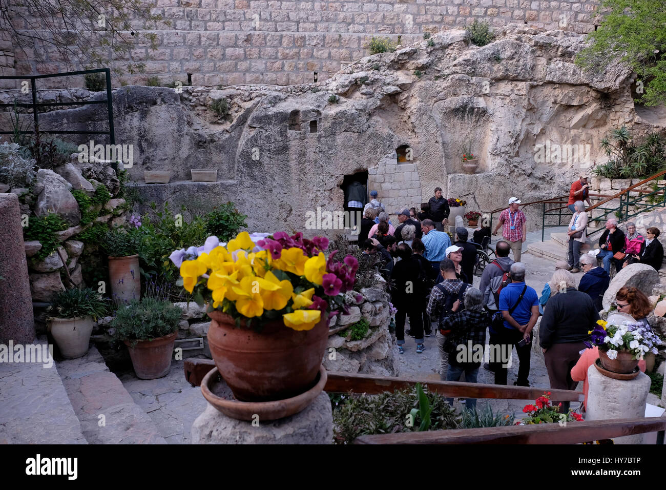 Tourists wait in line to enter the rock-cut Garden Tomb or Gordon's ...