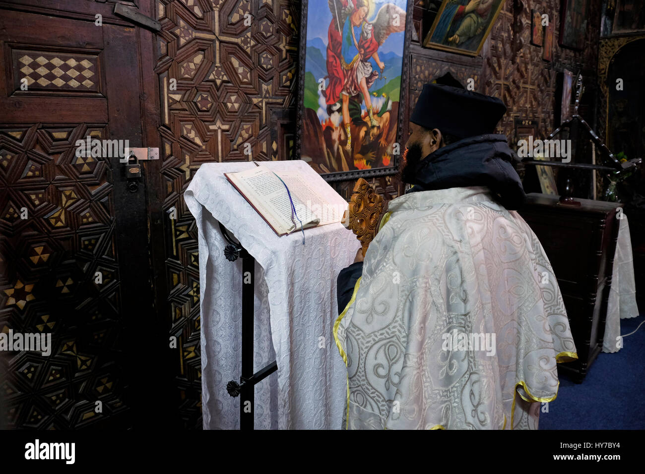 Ethiopian Orthodox priests and monks praying inside the Coptic Chapel of St. Michael the ...