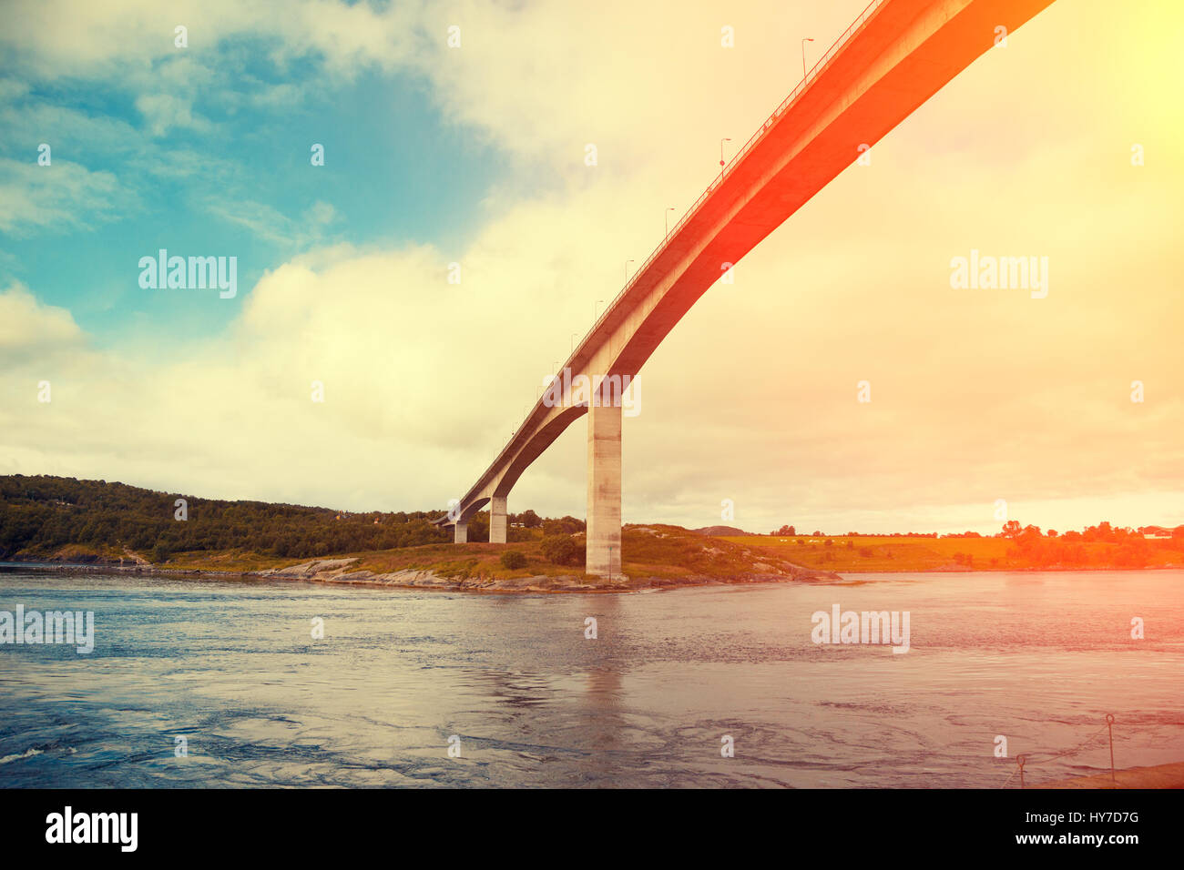 Bridge over fjord at sunset. Whirlpools of the maelstrom of ...