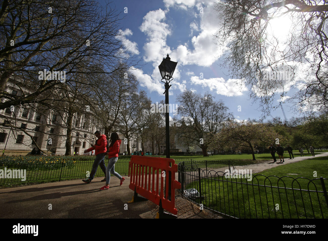 Old-fashioned lamp posts are erected in St James's Park, central London ...