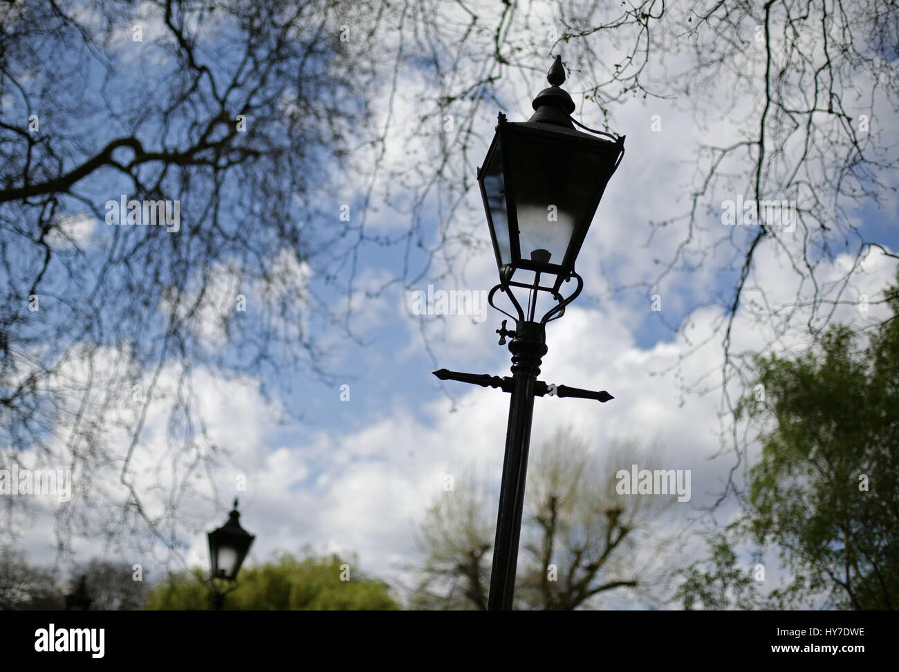 Old-fashioned lamp posts are erected in St James's Park, central London ...