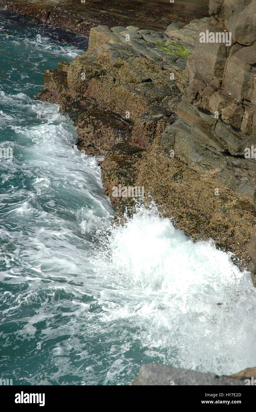 Waves crashing onto rocks, seen from above Stock Photo - Alamy
