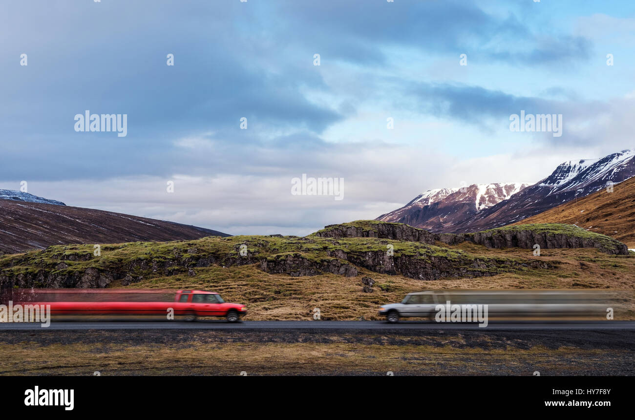 Two car facing together on country road in sunset Stock Photo - Alamy