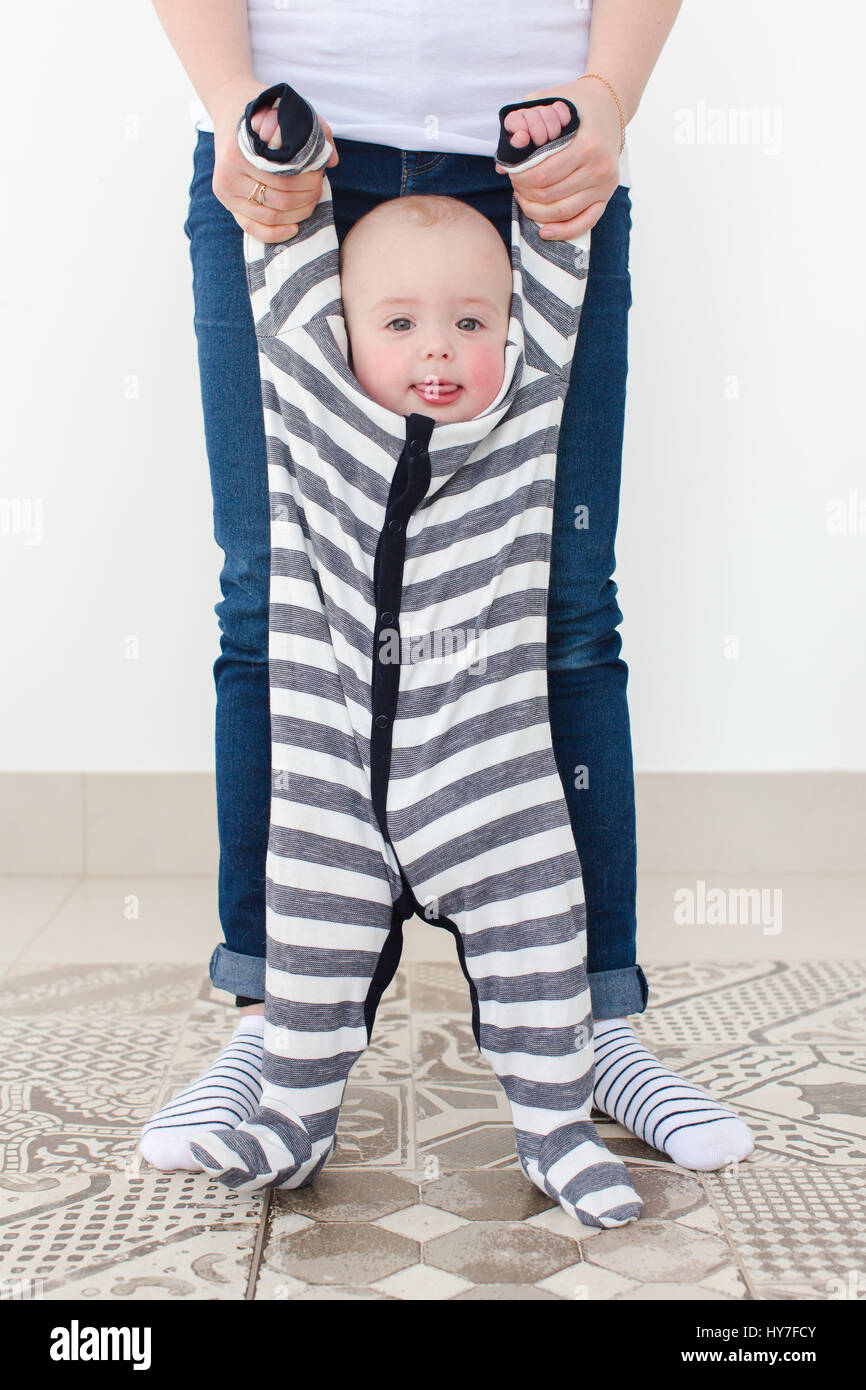 A parent supporting a child Stock Photo - Alamy