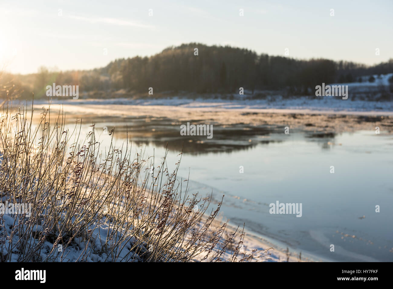 beautiful snowy winter landscape with frozen river and blue sky Stock ...