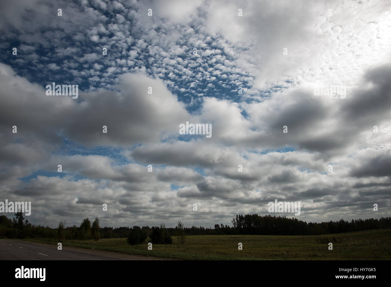 Country landscape under morning sky with clouds. Overcast sky before ...