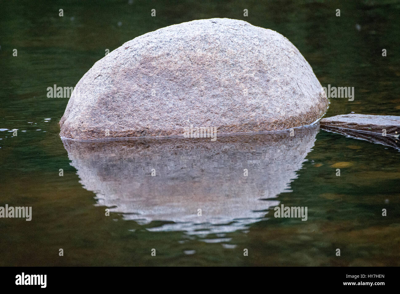 reflection of the rock on the water Stock Photo - Alamy