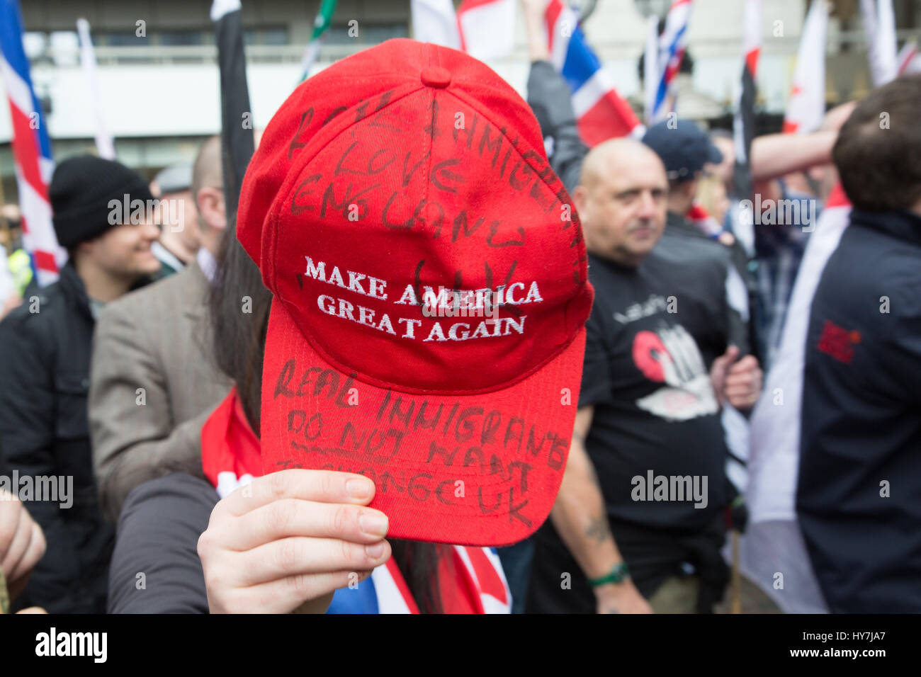 London, UK. 1st Apr, 2017. A woman holding a Donald Trump campaign hat ...