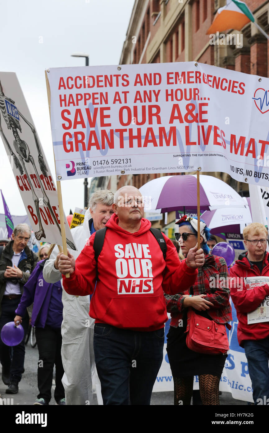 Leeds, UK. 1st April, 2017. A man wearing a "Save Our NHS" sweater ...