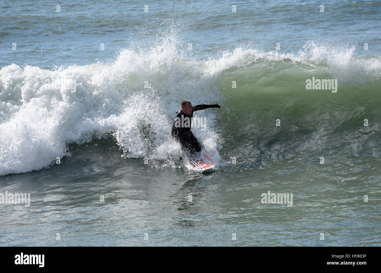 Portland, Dorset, UK. 2nd April 2017. UK Weather. Surfers enjoy the ...