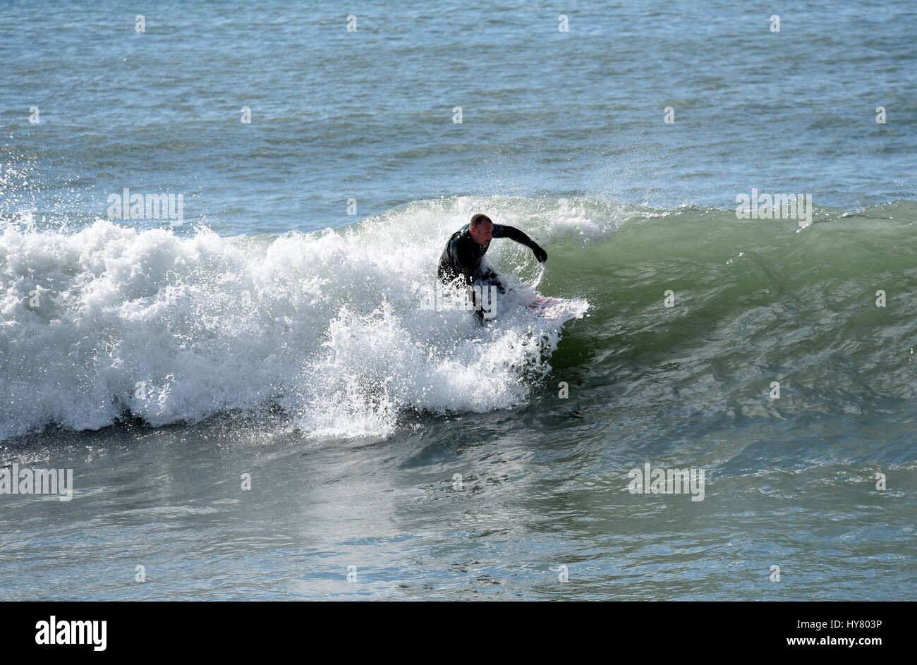 Portland, Dorset, UK. 2nd April 2017. UK Weather. Surfers enjoy the ...