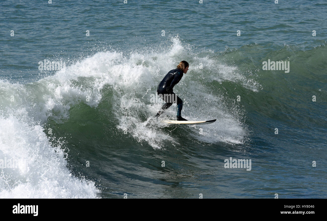 Portland, Dorset, UK. 2nd April 2017. UK Weather. Surfers enjoy the ...