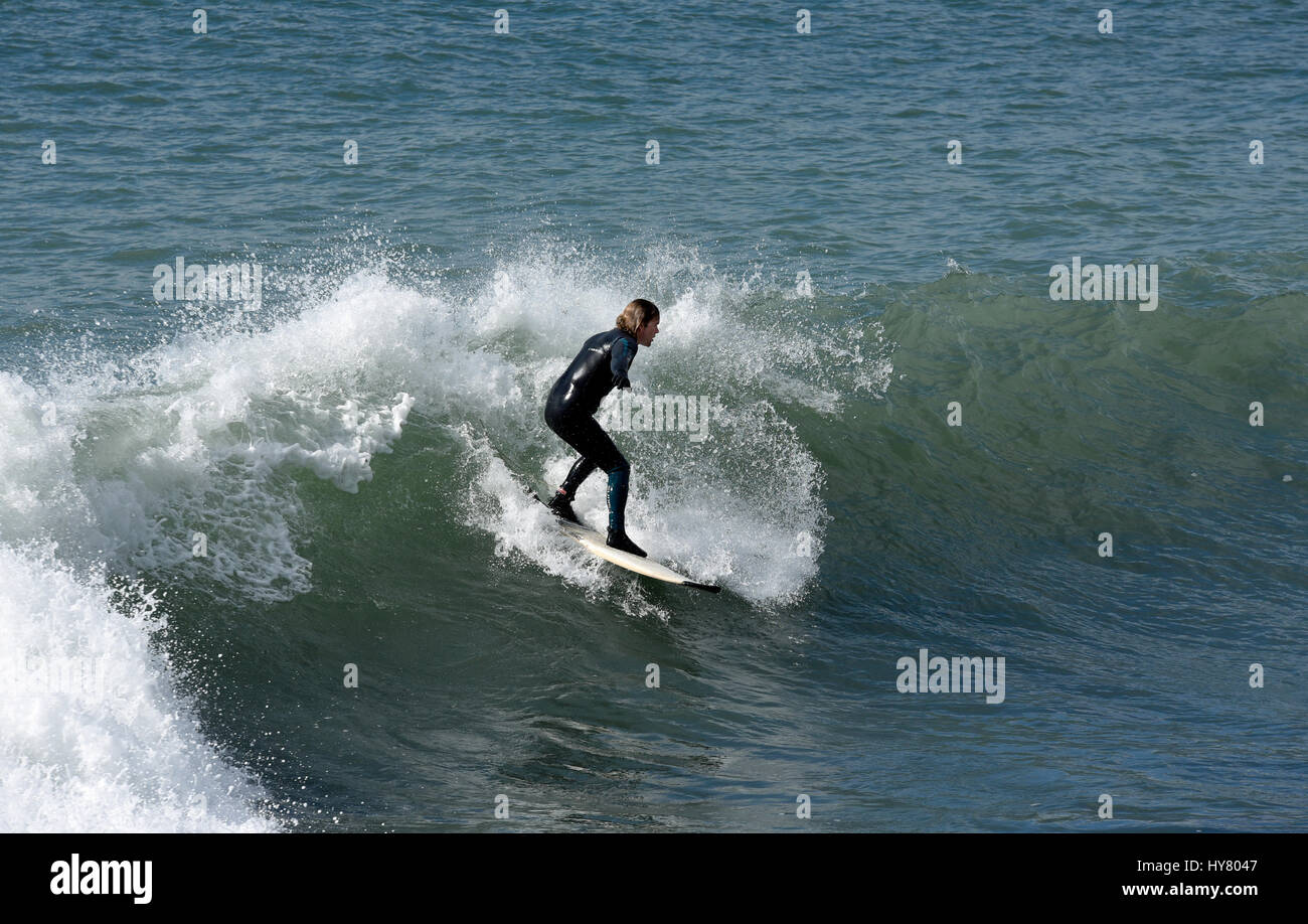 Portland, Dorset, UK. 2nd April 2017. UK Weather. Surfers enjoy the ...