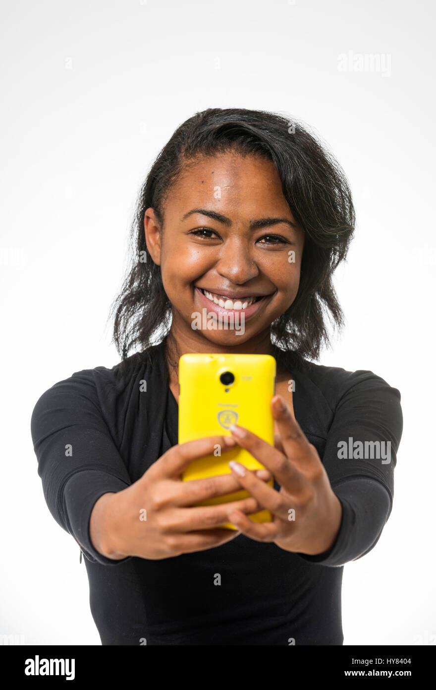 African woman uses cellphone hi-res stock photography and images - Alamy