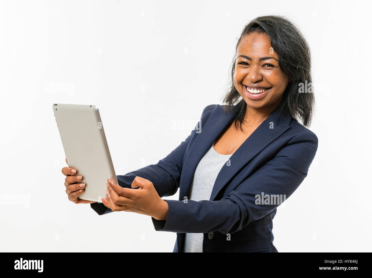 An African woman uses a tablet in a studio environment Stock Photo - Alamy
