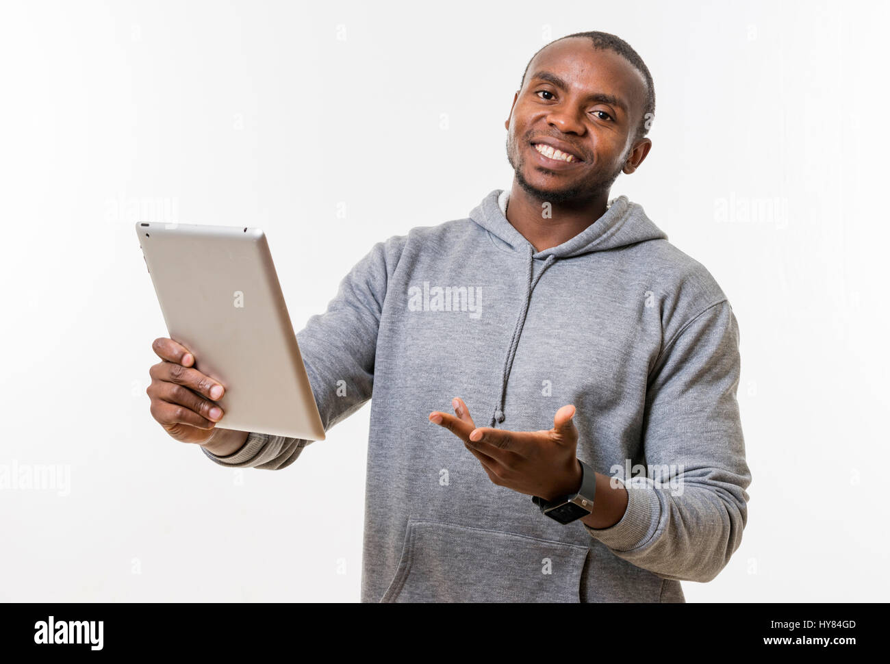 An African man uses a tablet in a studio environment Stock Photo - Alamy