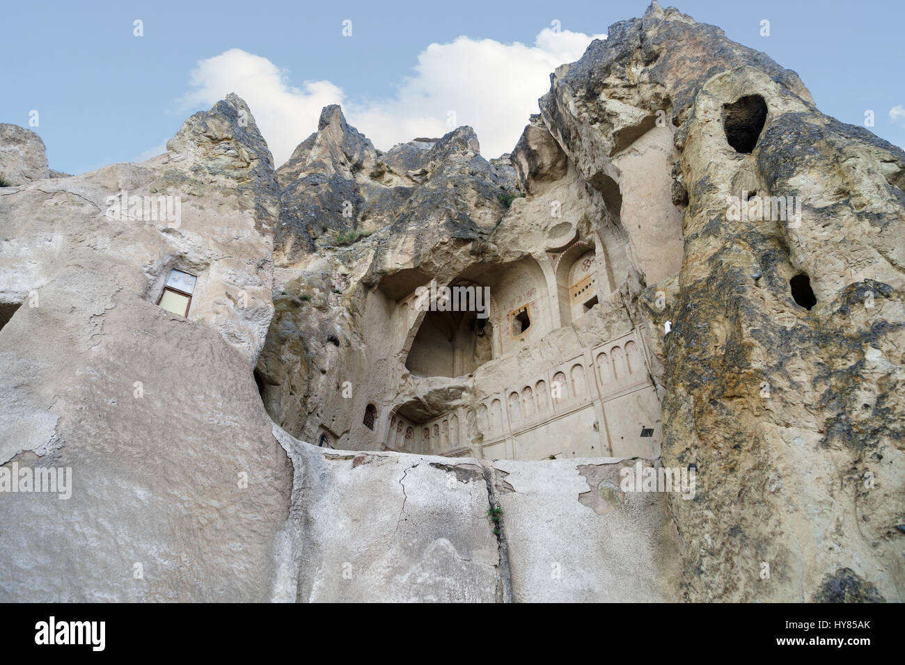 View of famous and natural cave basilica and fairy chimneys in Goreme ...