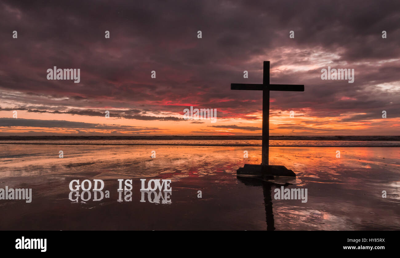Cross on a beach at Sunset, with a wonderful reflection and the word ...