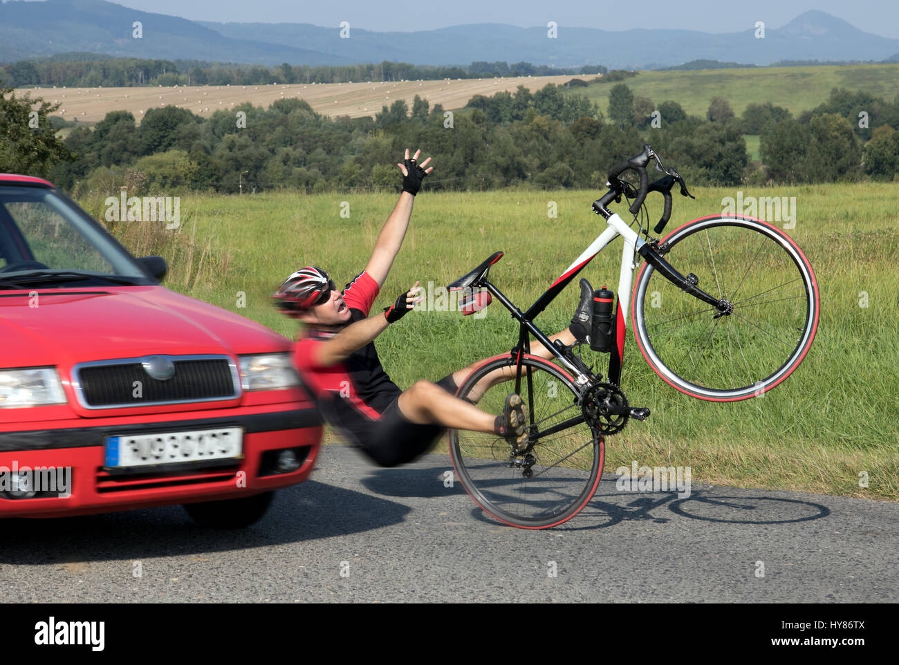 Accident cars with biker. Car collides cyclist on the road. Dangerous ...