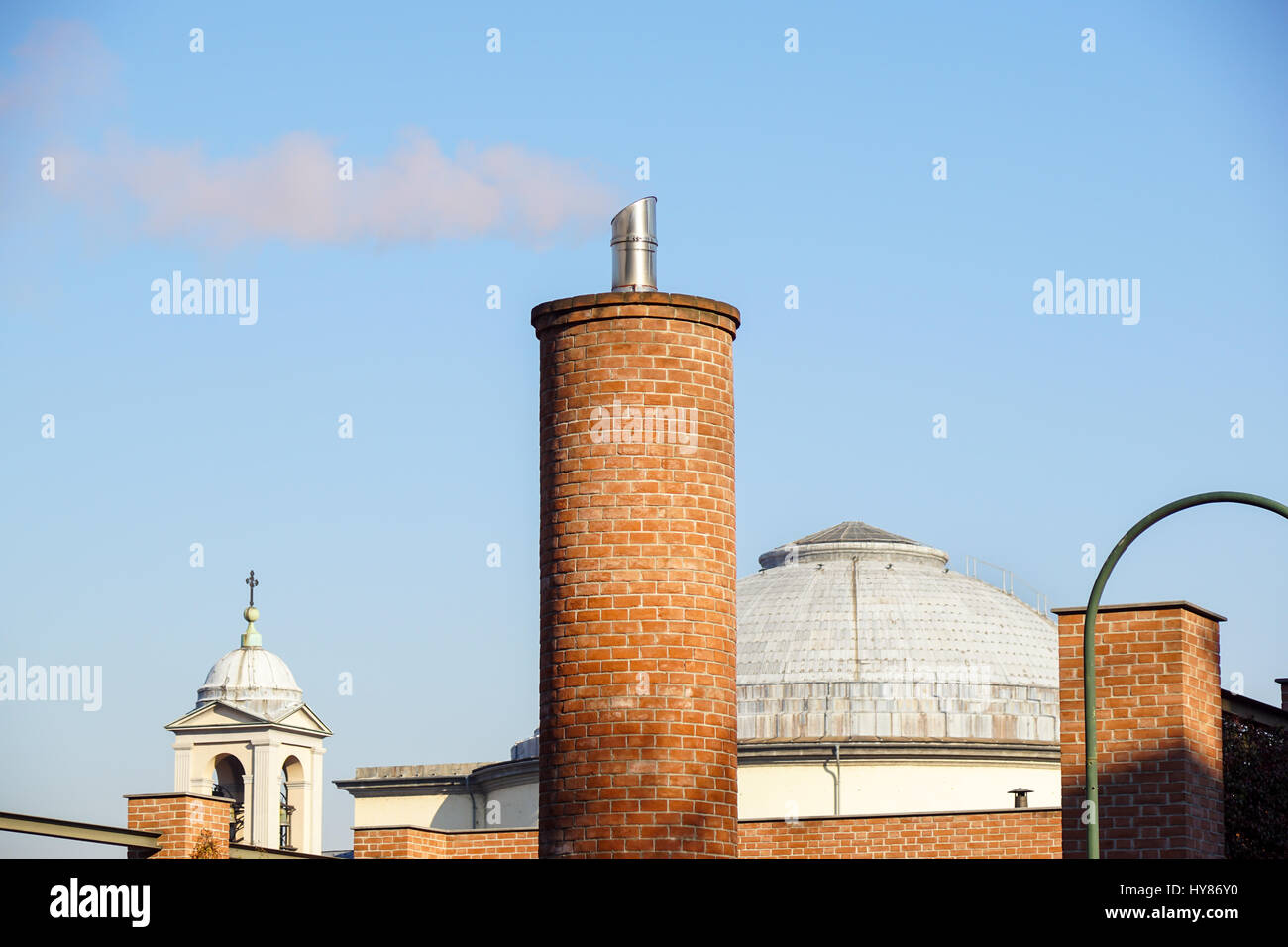 close up of beautiful arabesque white chimney on the roof rising up in ...