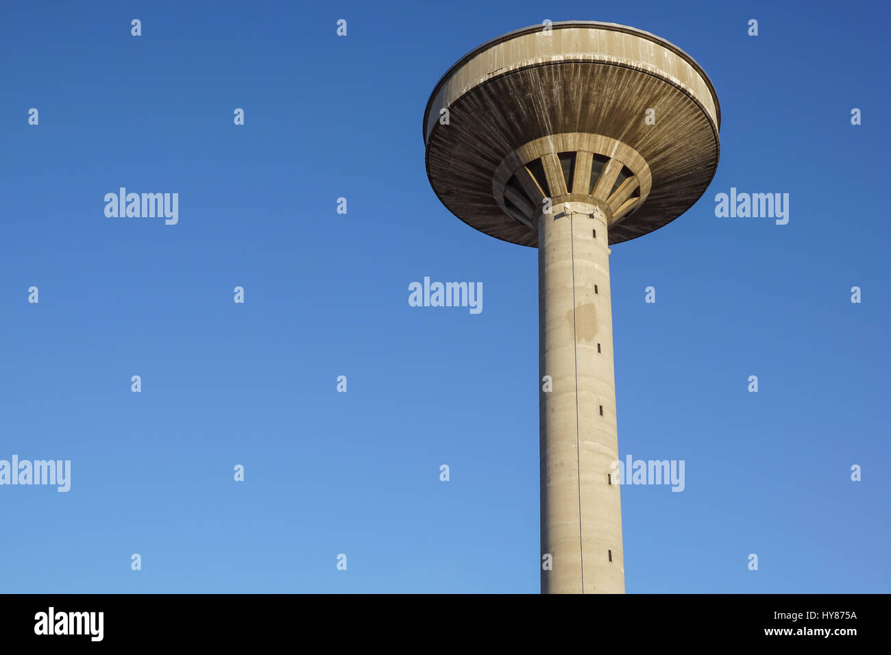 concrete two water towers against blue sky Stock Photo - Alamy