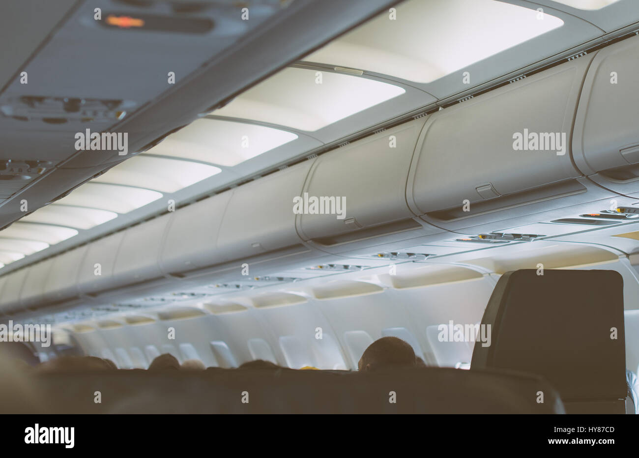 Interior inside of the plane with passengers Stock Photo - Alamy