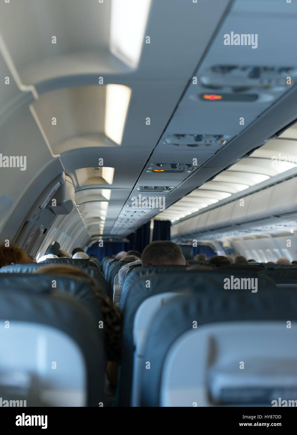Interior inside of the plane with passengers Stock Photo - Alamy