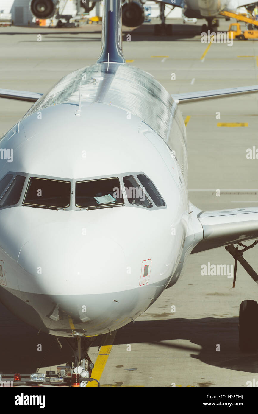Close-up view of airplane on airfield in airport Stock Photo - Alamy