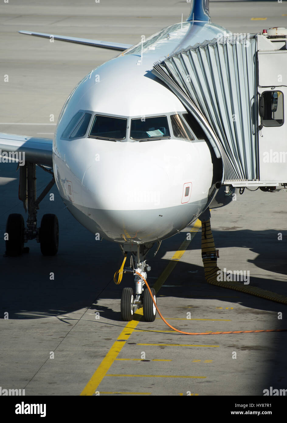 Passenger plane in the airport. Boarding Stock Photo - Alamy