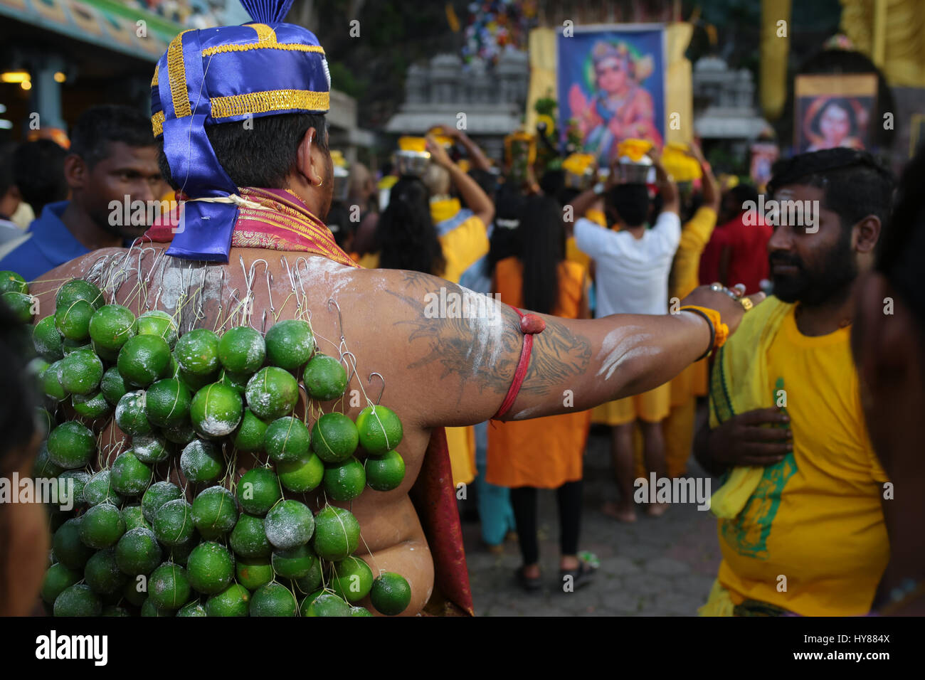 Thaipusam kavadi bearer blessing a hindu believer at Batu Cave temple ...