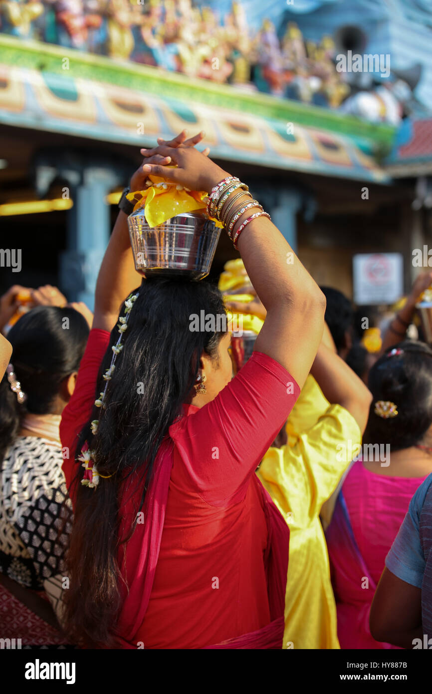 Female paal kudam bearers dressed in red at Batu Cave temple, Kuala ...
