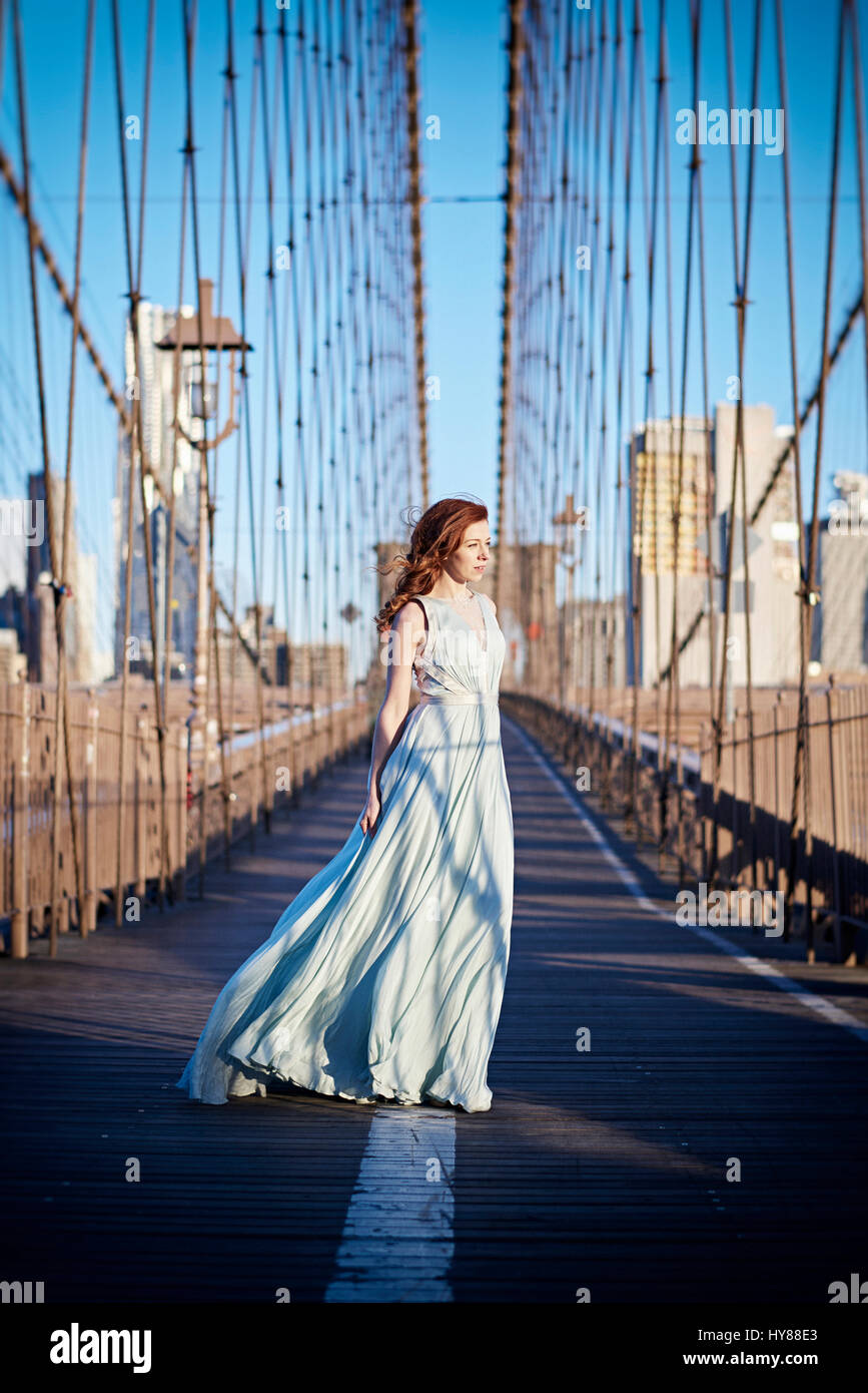 Young women in Blue gown on the Brooklyn bridge New York city Stock ...