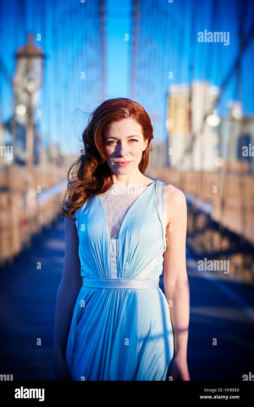 Young women in Blue gown on the Brooklyn bridge New York city Stock ...