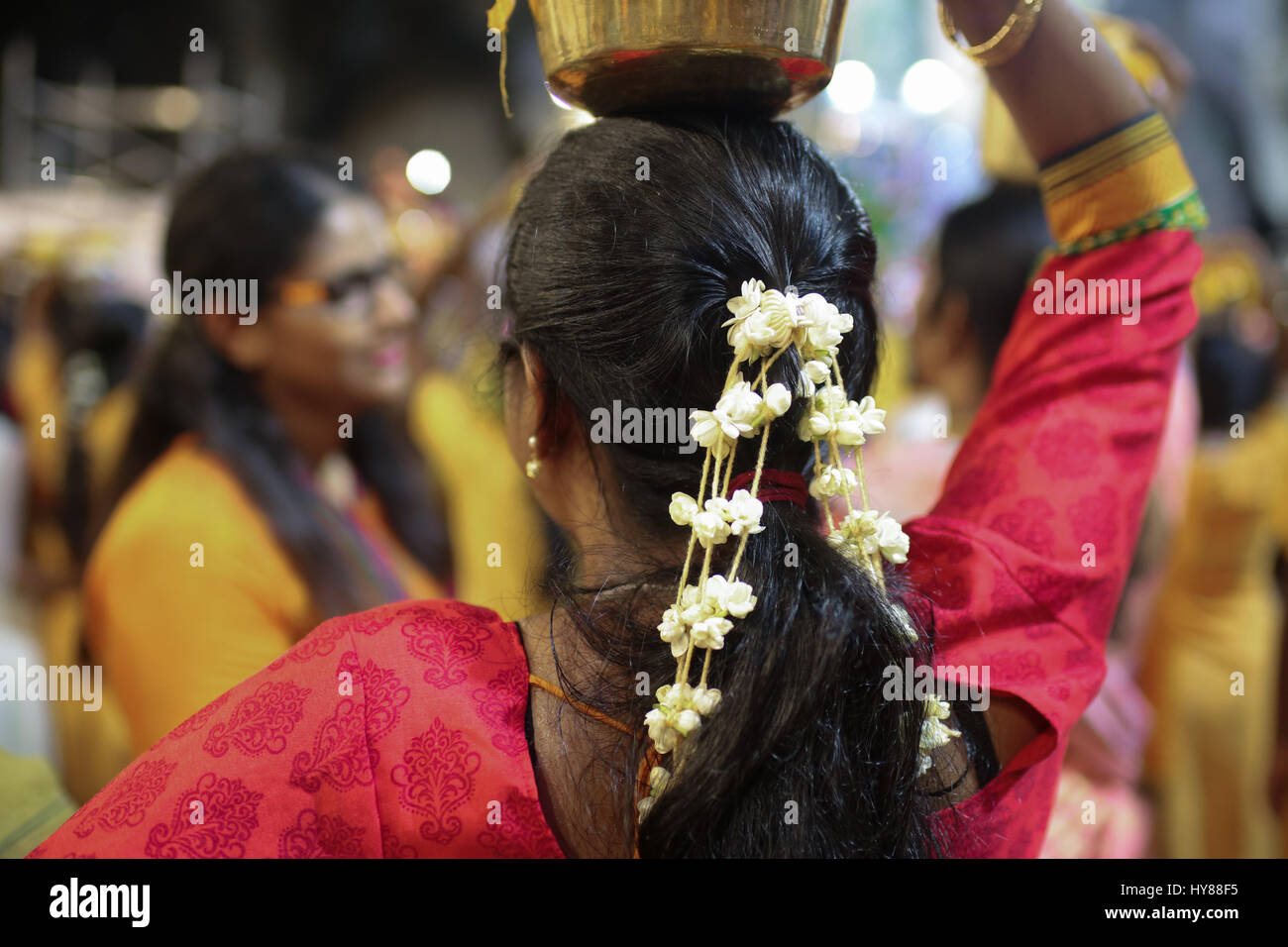 Female paal kudam bearers dressed in red at Batu Cave temple, Kuala ...
