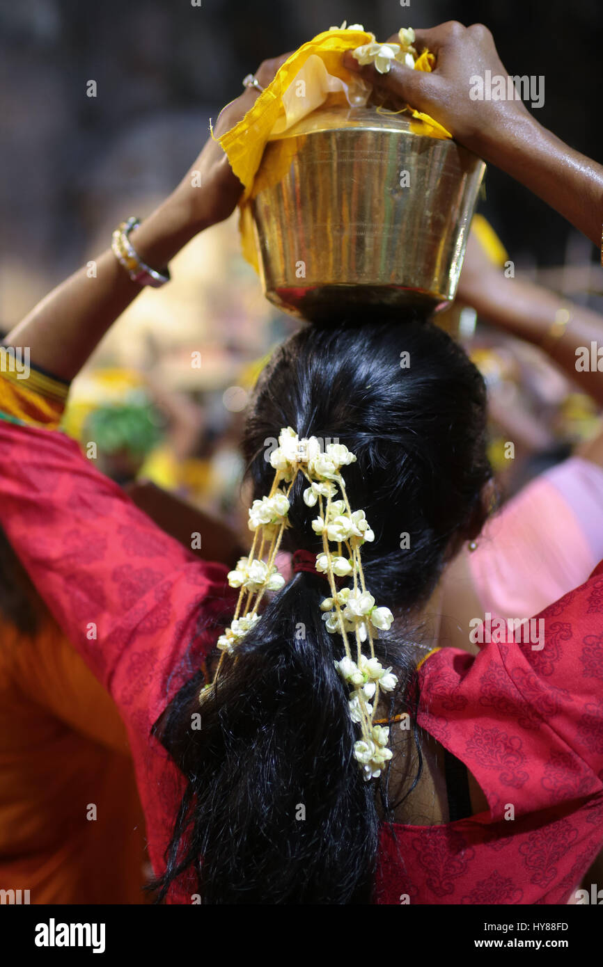 Female paal kudam bearers dressed in red at Batu Cave temple, Kuala ...
