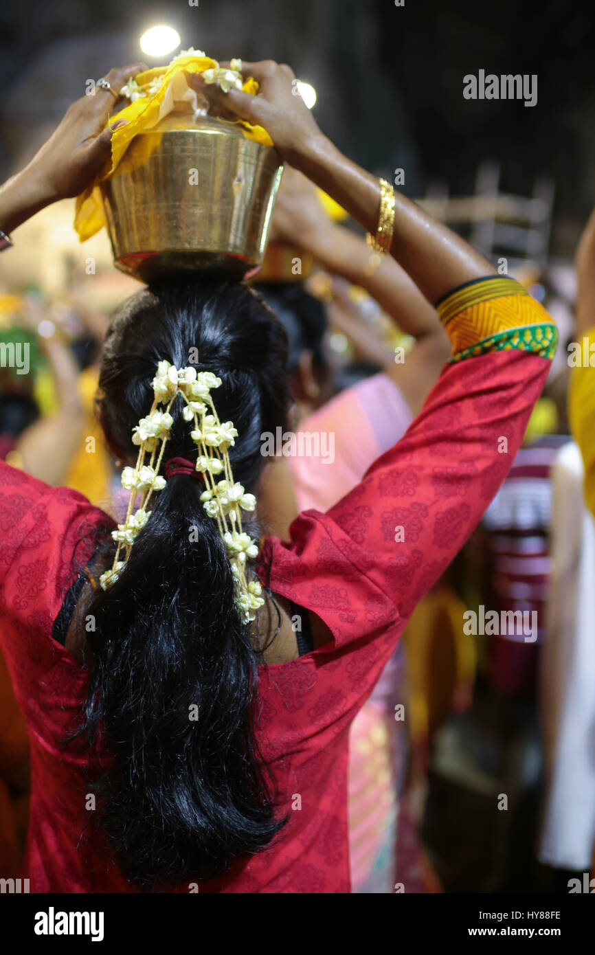 Female paal kudam bearers dressed in red at Batu Cave temple, Kuala ...