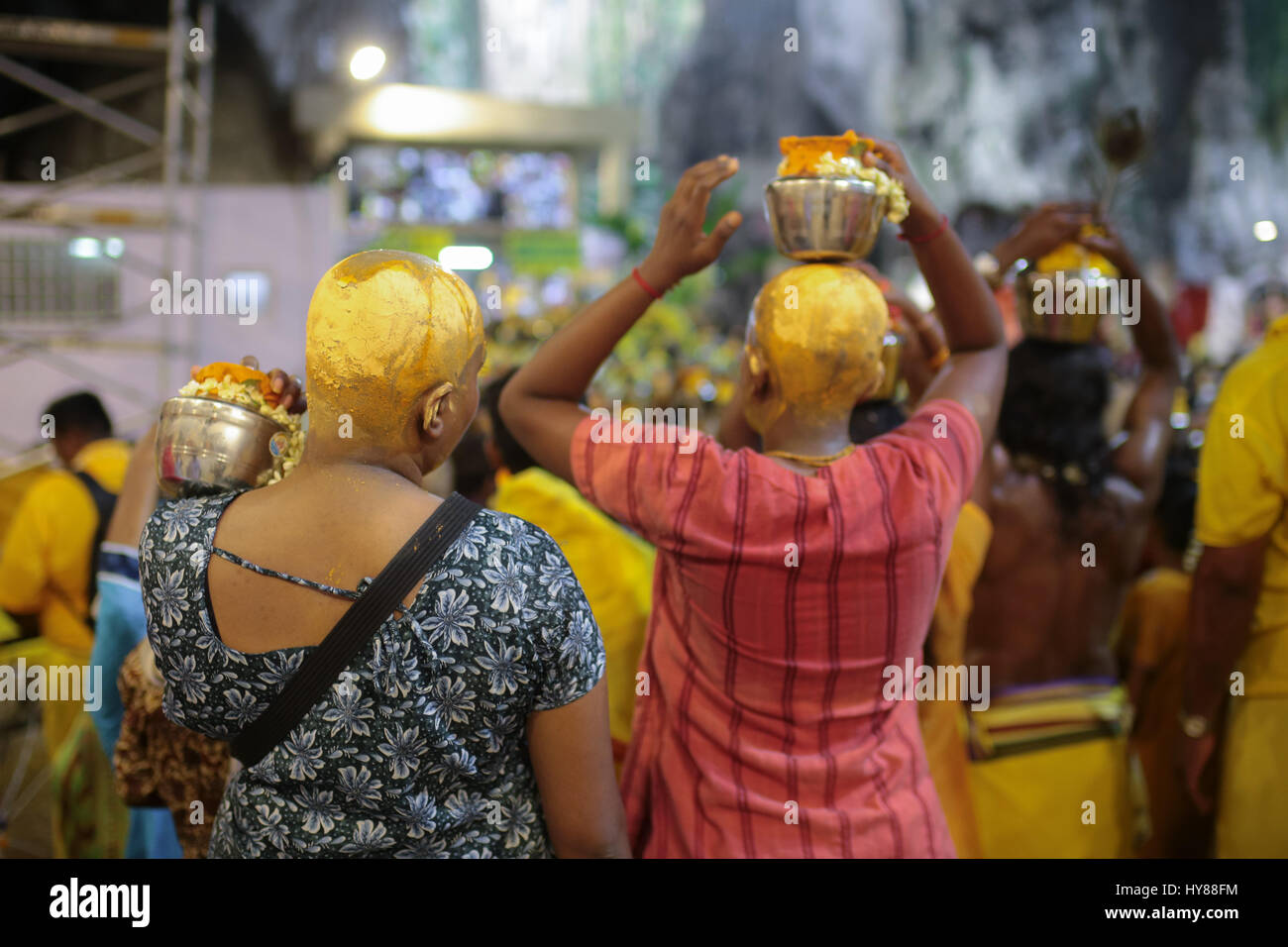Female paal kudam bearers with shaved head at Batu Cave temple, Kuala ...