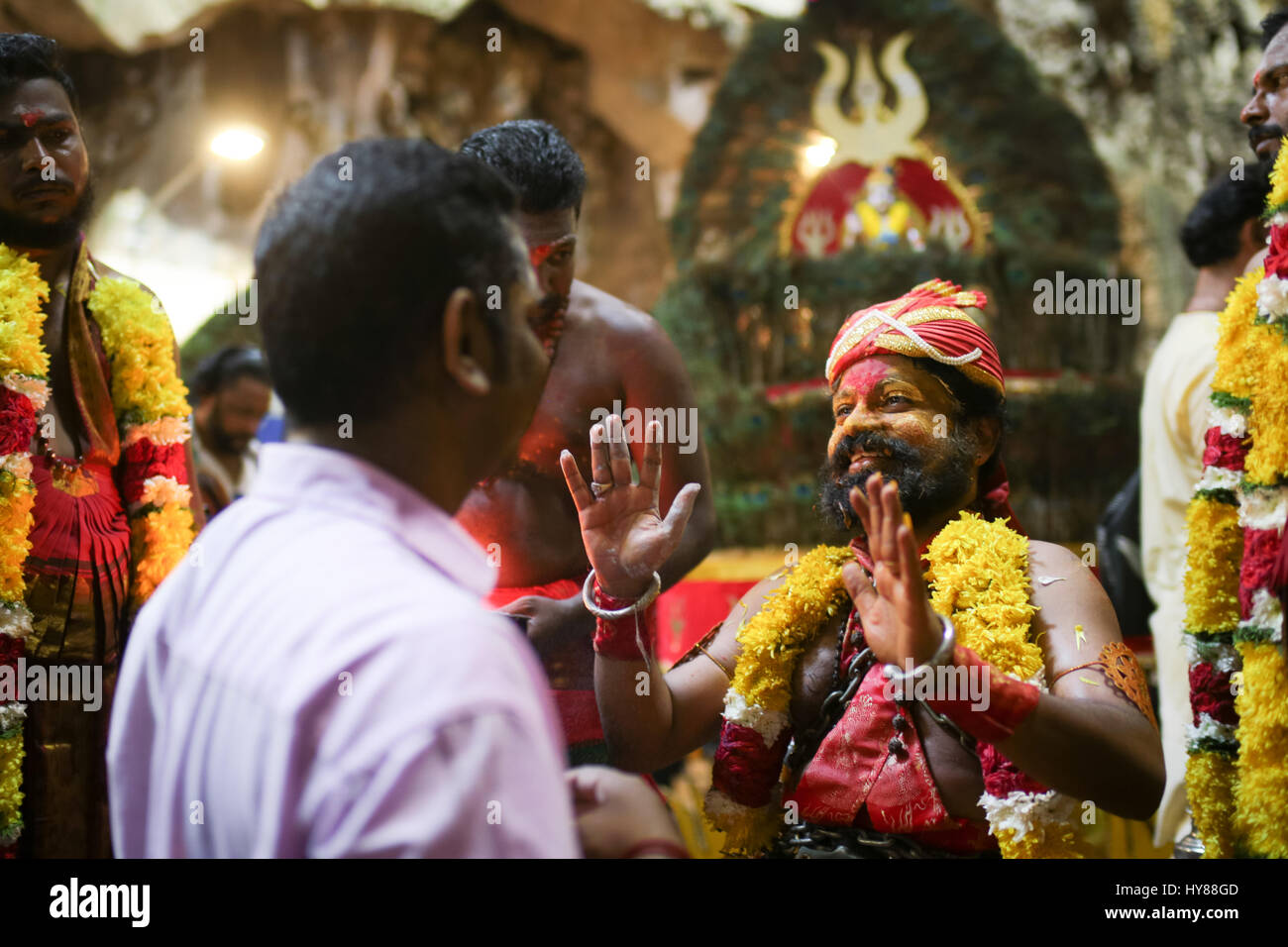 Thaipusam kavadi bearer bestows blessing to believer at Batu Cave ...