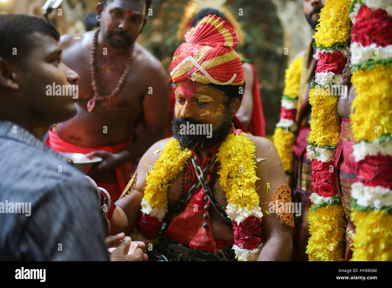 Thaipusam kavadi bearer bestows blessing to believer at Batu Cave ...