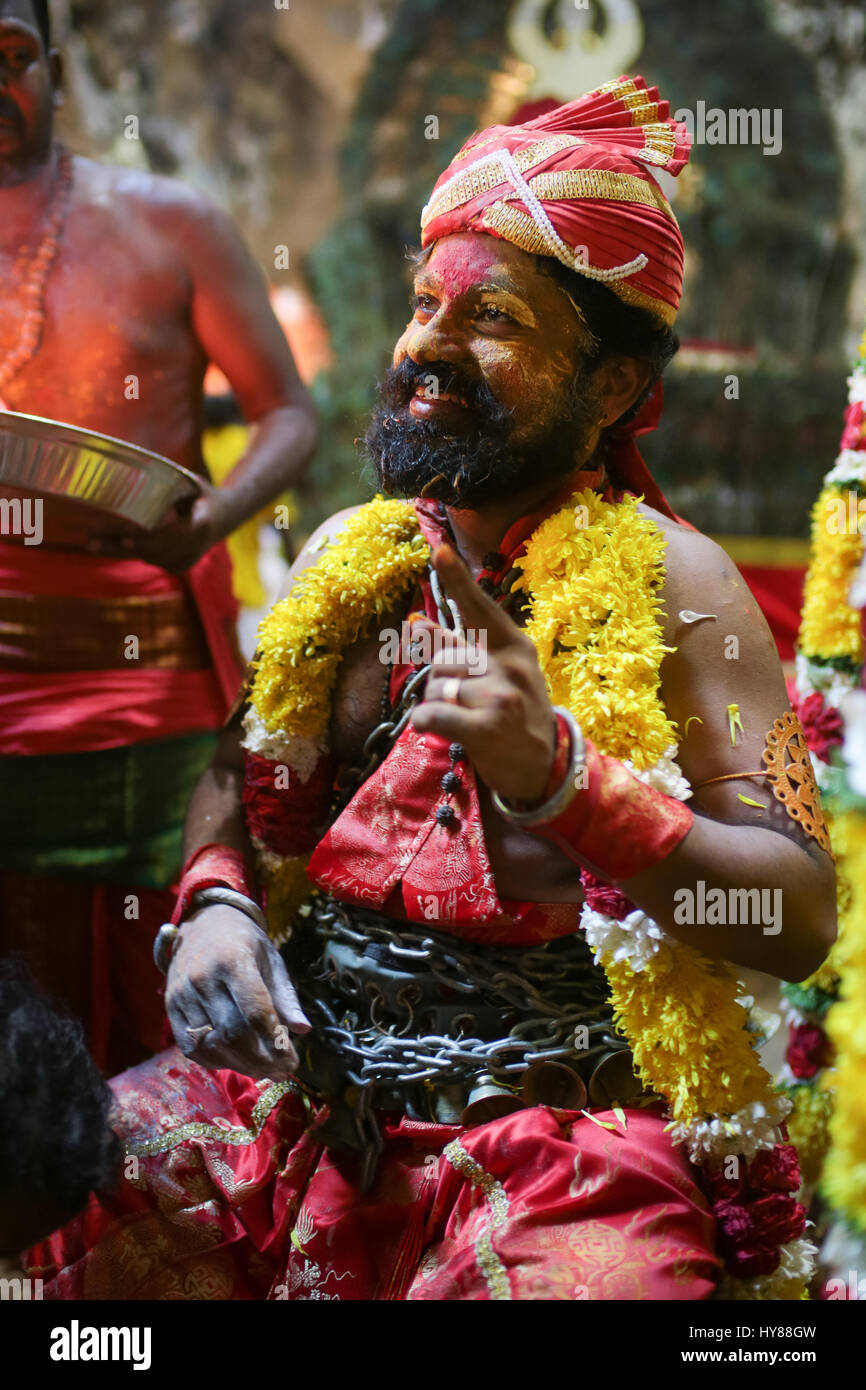 Thaipusam kavadi bearer bestows blessing to believer at Batu Cave ...