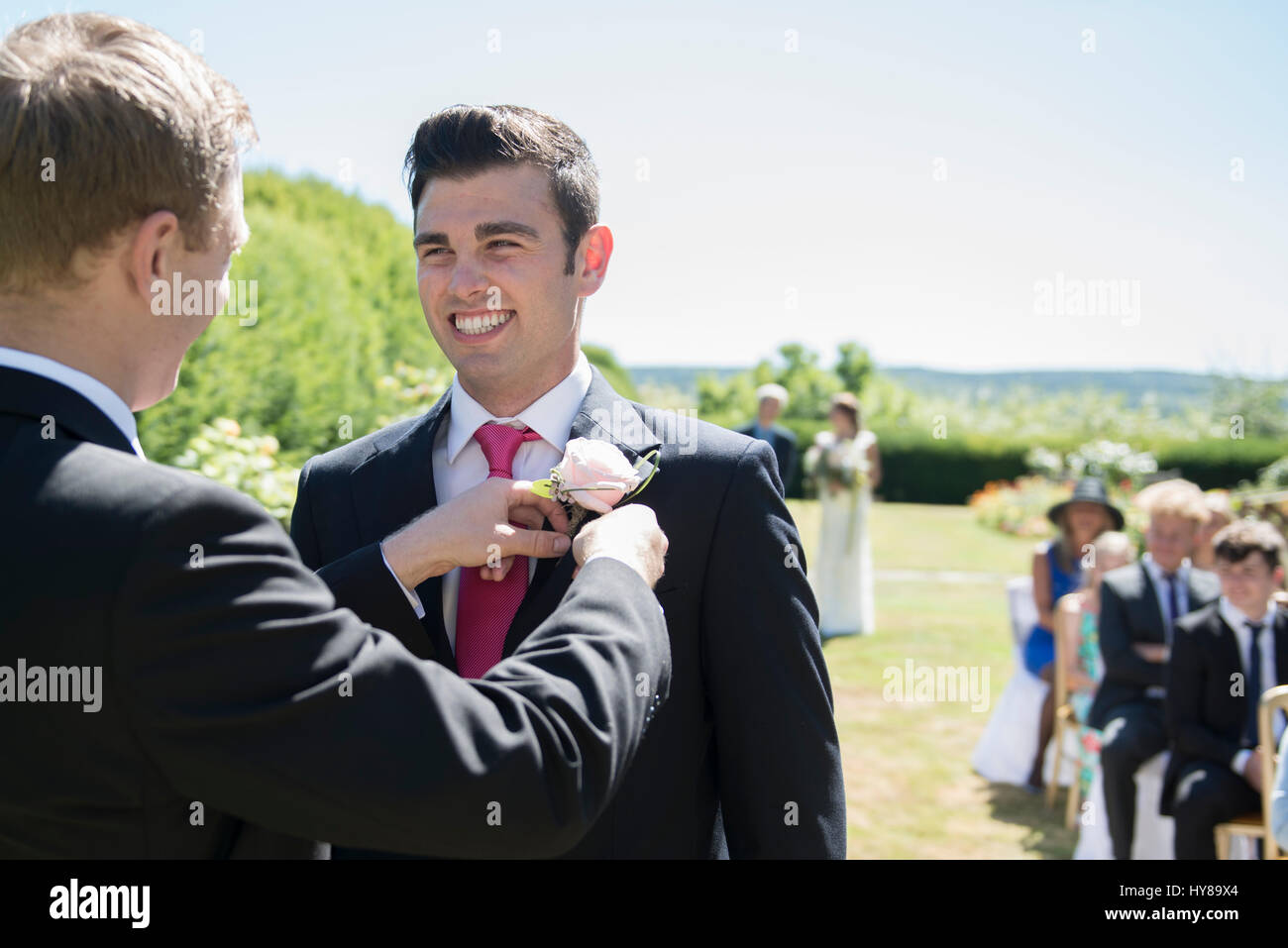 A groom and best man waiting for the bride prior to the wedding service ...