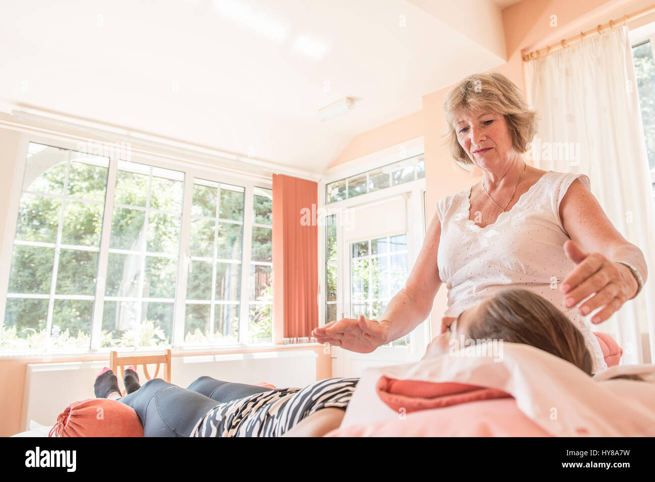 A spiritual healer at work Stock Photo - Alamy