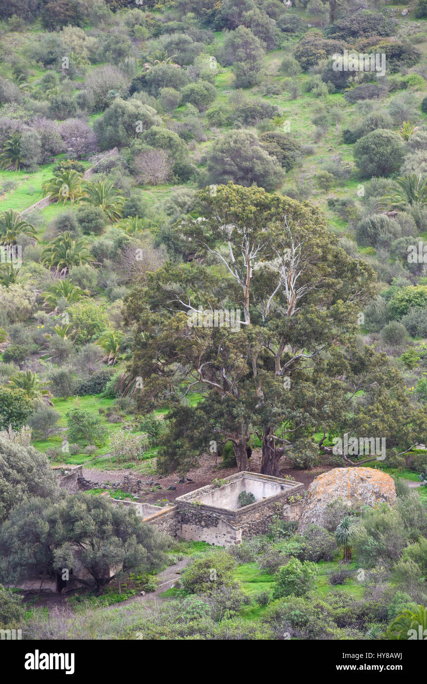 House without roof inside the crater of a mountain Stock Photo - Alamy